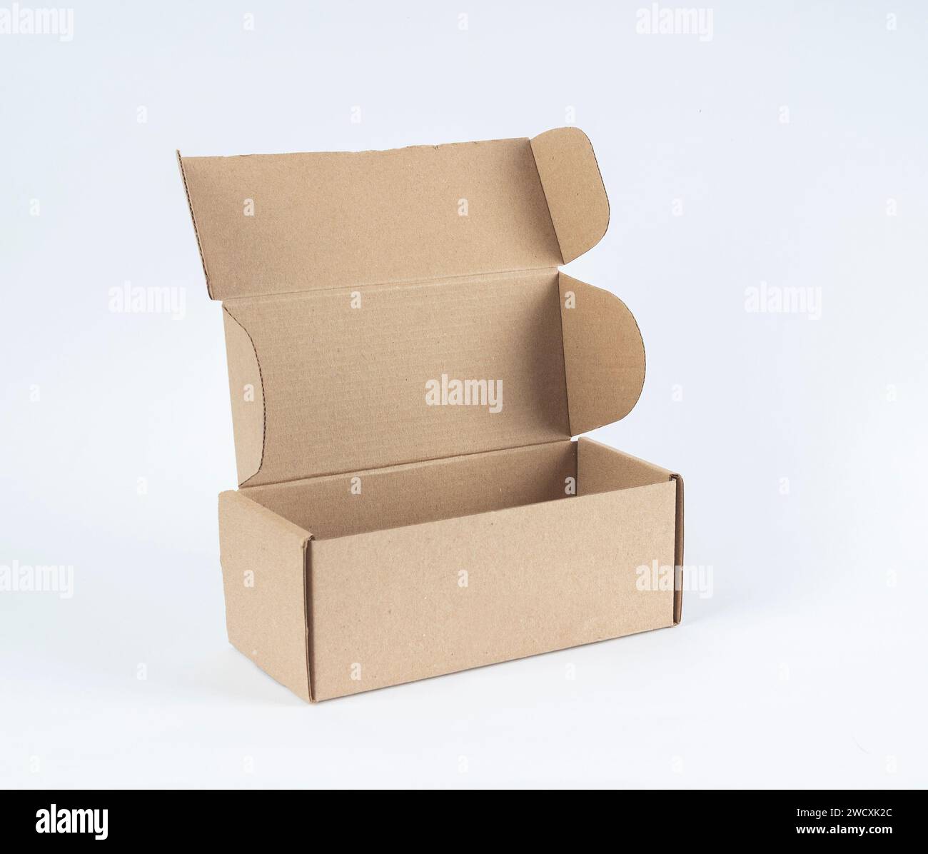 Open empty cardboard box isolated on white Stock Photo - Alamy
