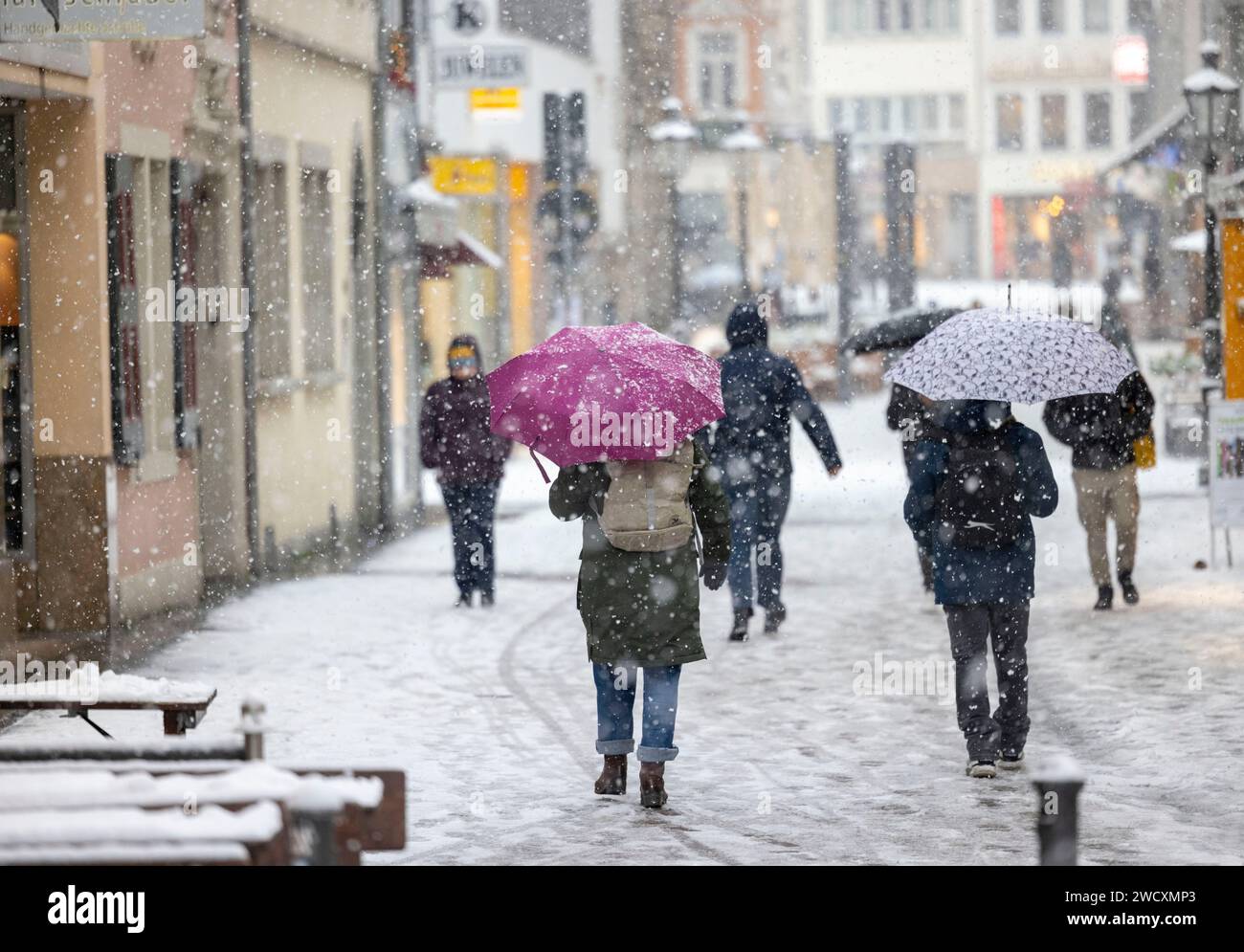 Bonn, Germany. 17th Jan, 2024. People walk through the city center in ...