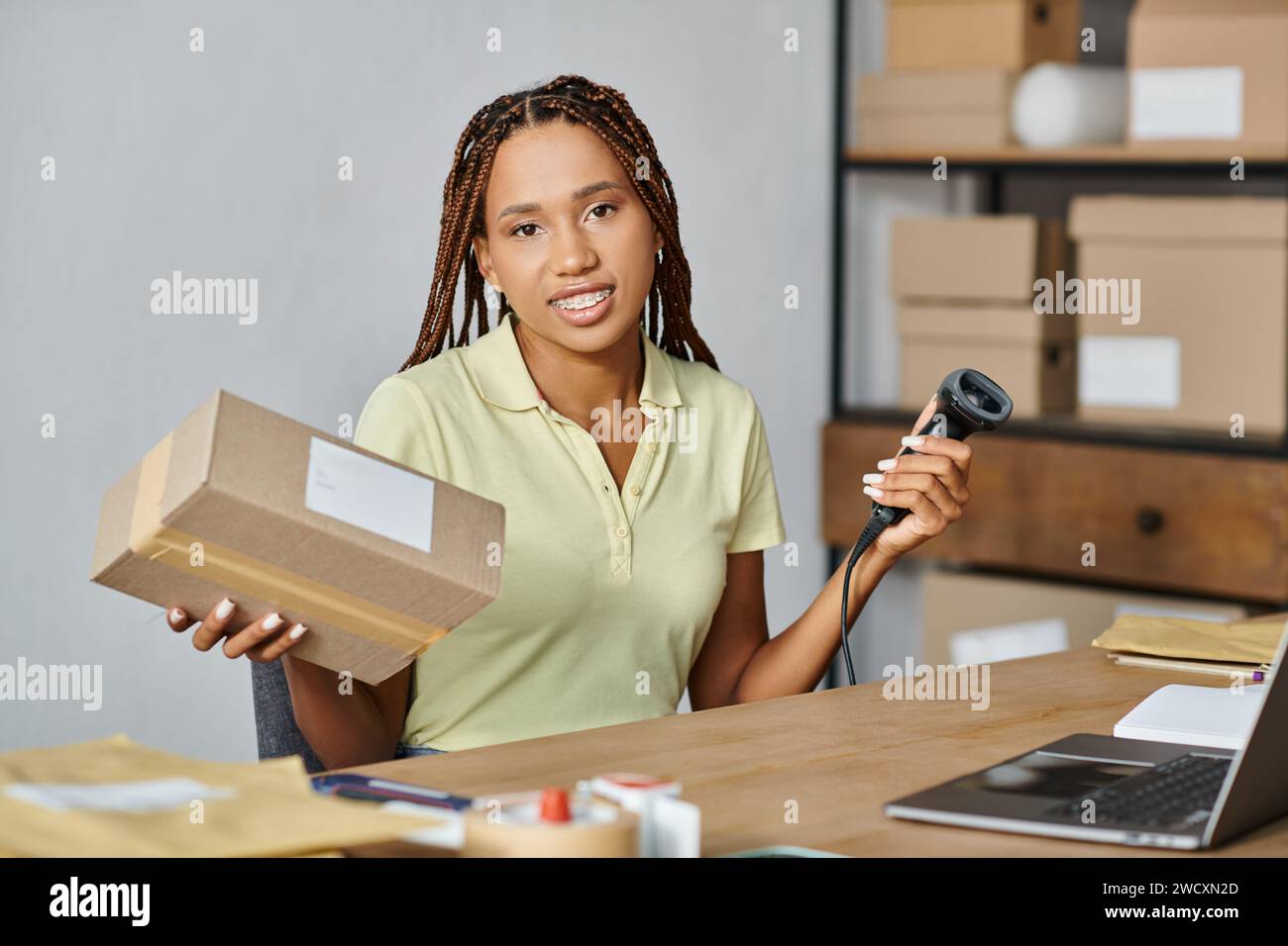 Woman scanning barcode shopping hi-res stock photography and images - Alamy