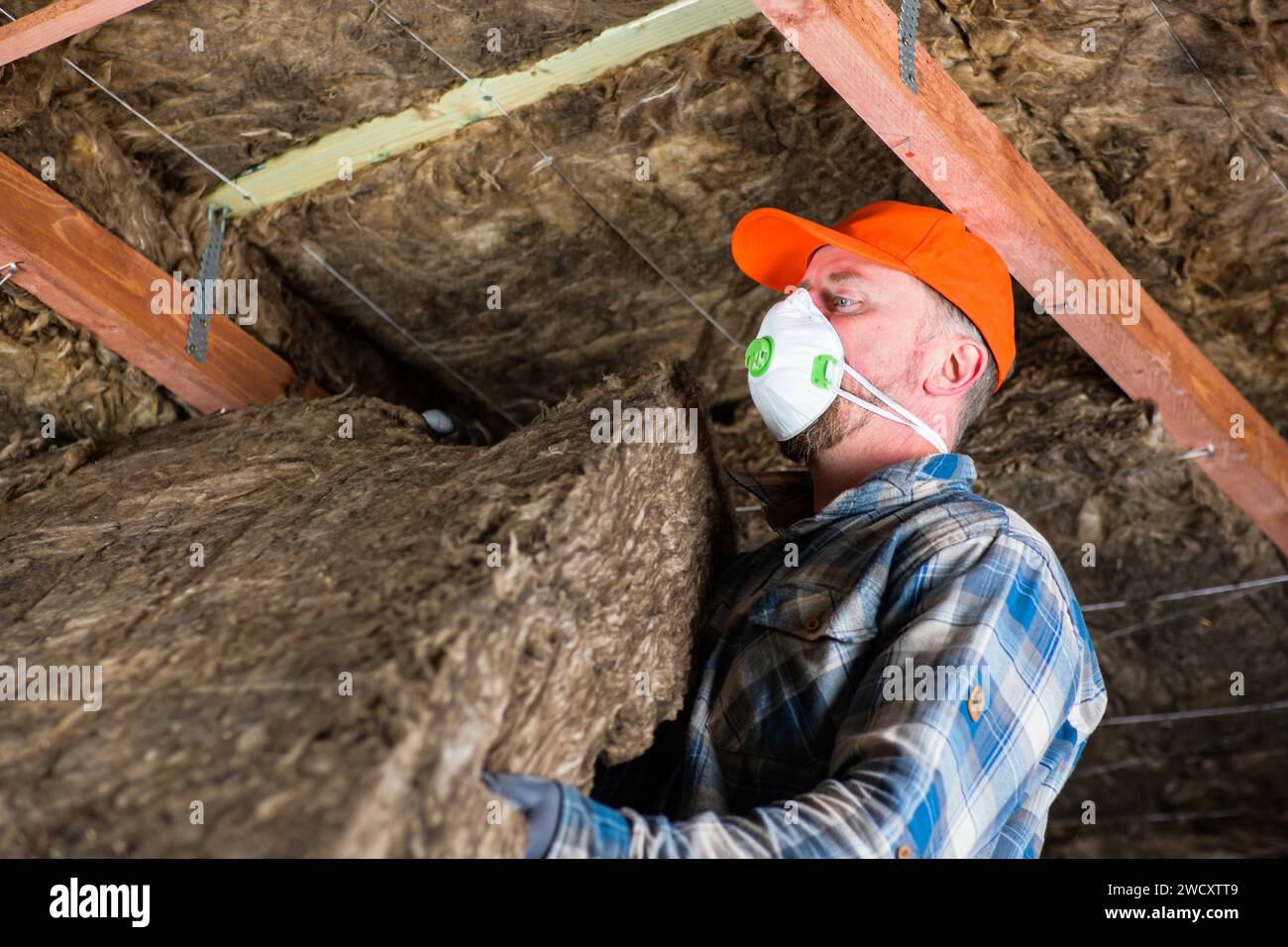 Installing insulation in attic hi-res stock photography and images - Alamy
