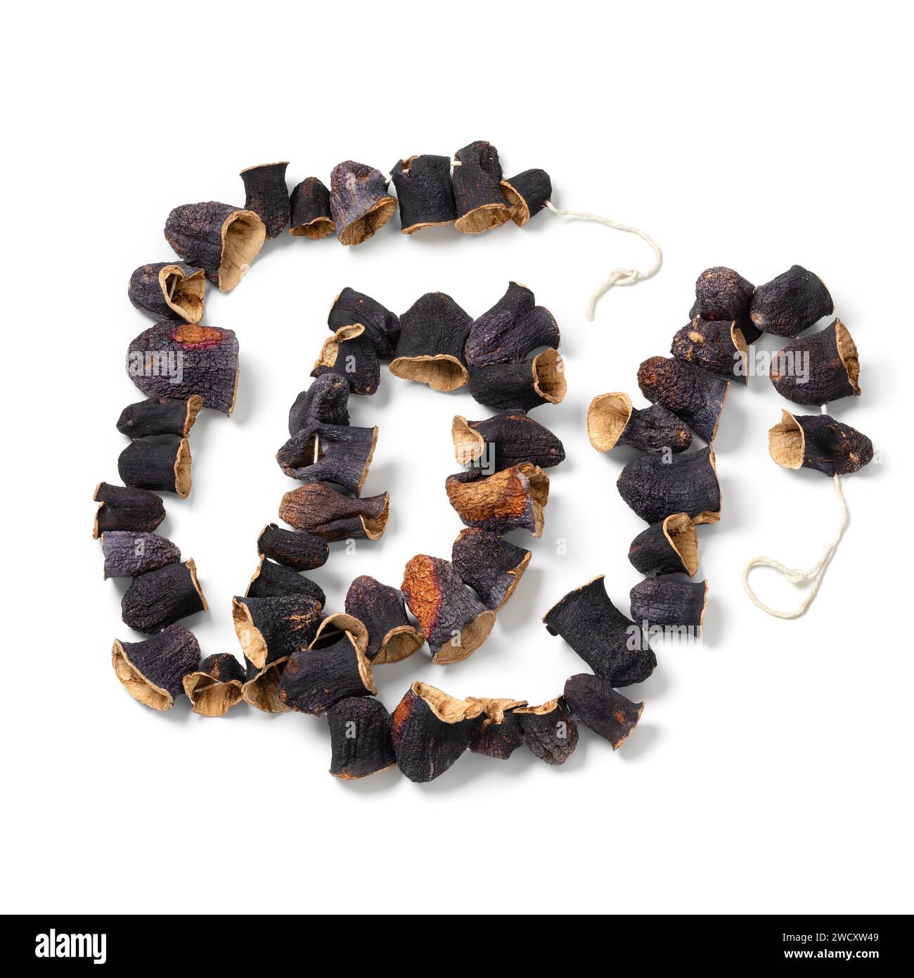 Chain of dried Turkish eggplants isolated on white background close up ...