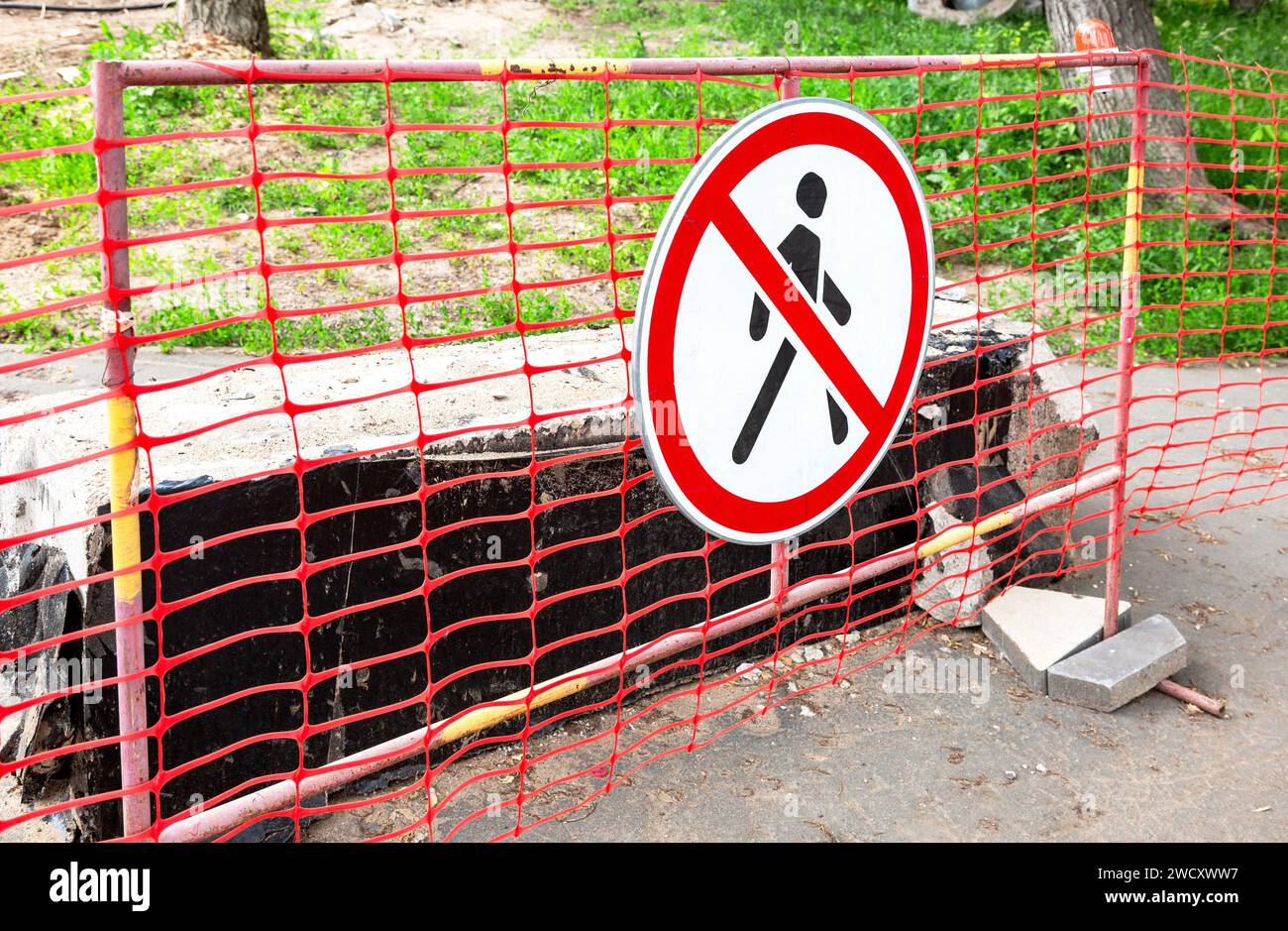 Road sign "No entry" at the city street. Carrying out construction and ...
