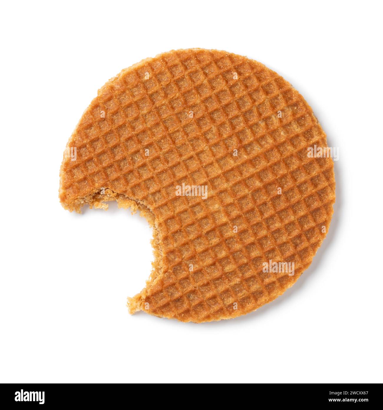 Single fresh baked stroopwafel, syrup waffle, with a bite out of it ...