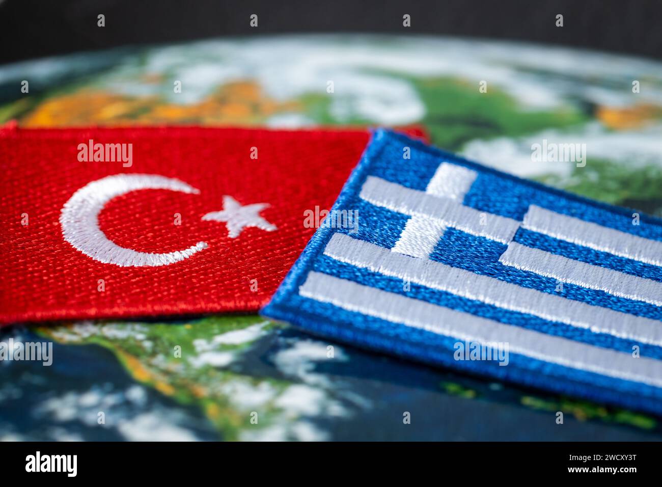 turkey and greece, country flags on the background of the globe ...