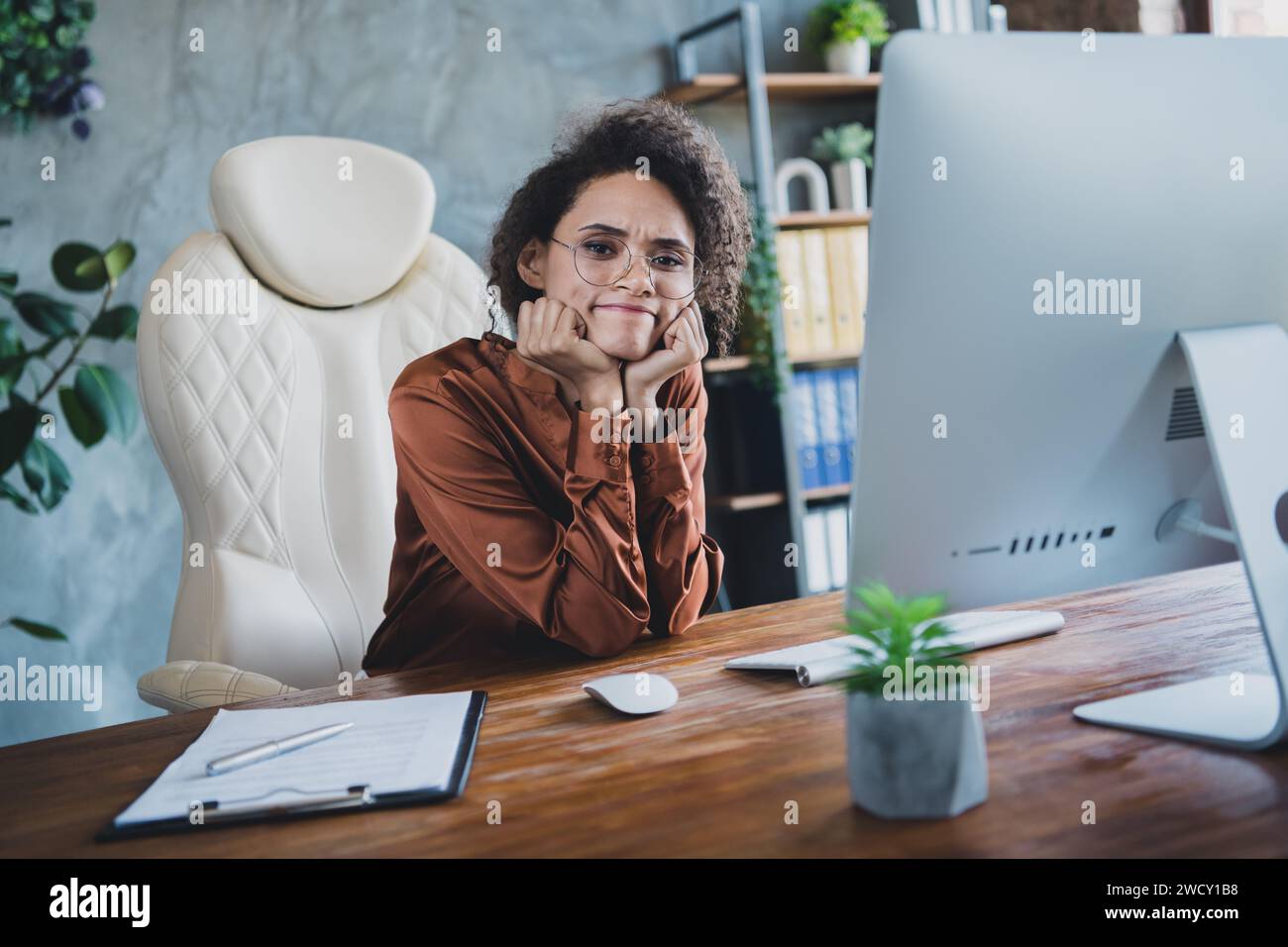 Portrait of lazy bored secretary young girl sit chair hands touch ...