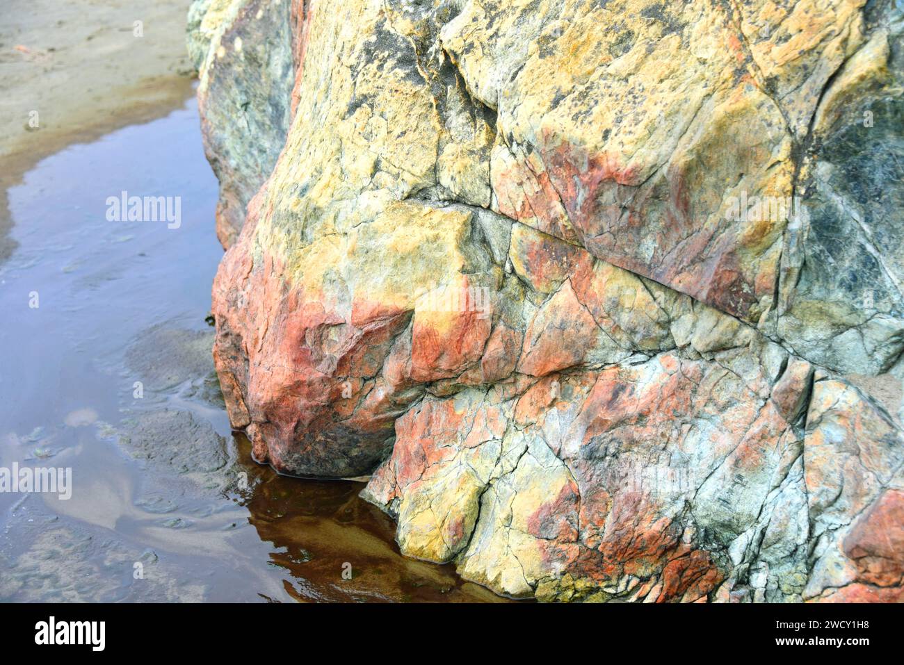 Beautiful and colorful rock outcrop sits on Bandon Beach, Oregon Stock ...