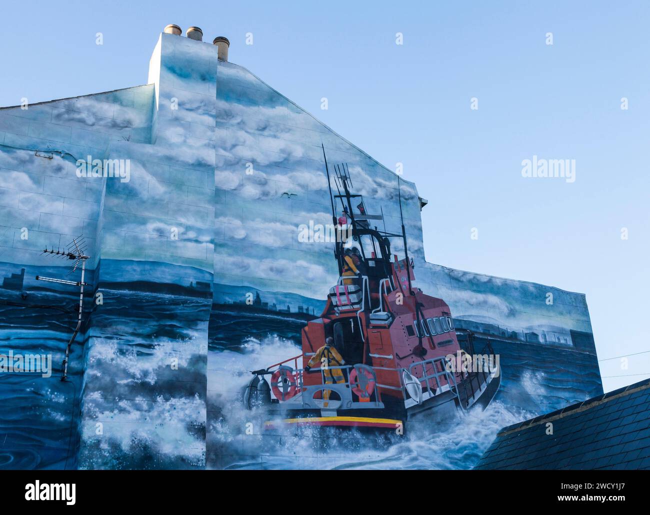 A stunning mural of a lifeboat at sea on the wall of the Ship Inn pub ...