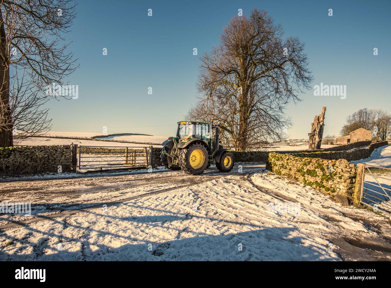 Young farmer on his return tractor journey after taking a trailer load ...
