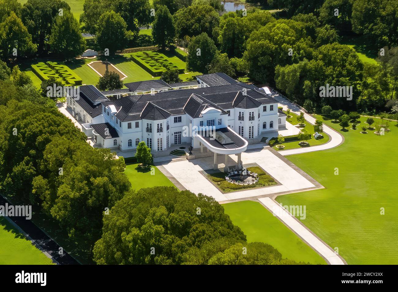 Aerial view of a luxurious mansion and garden in Tallebudgera Mansion ...