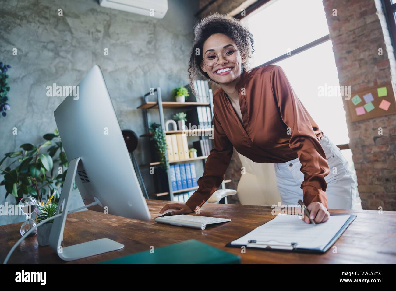 Photo of pretty cheerful ceo assistant girl toothy smile pen write ...