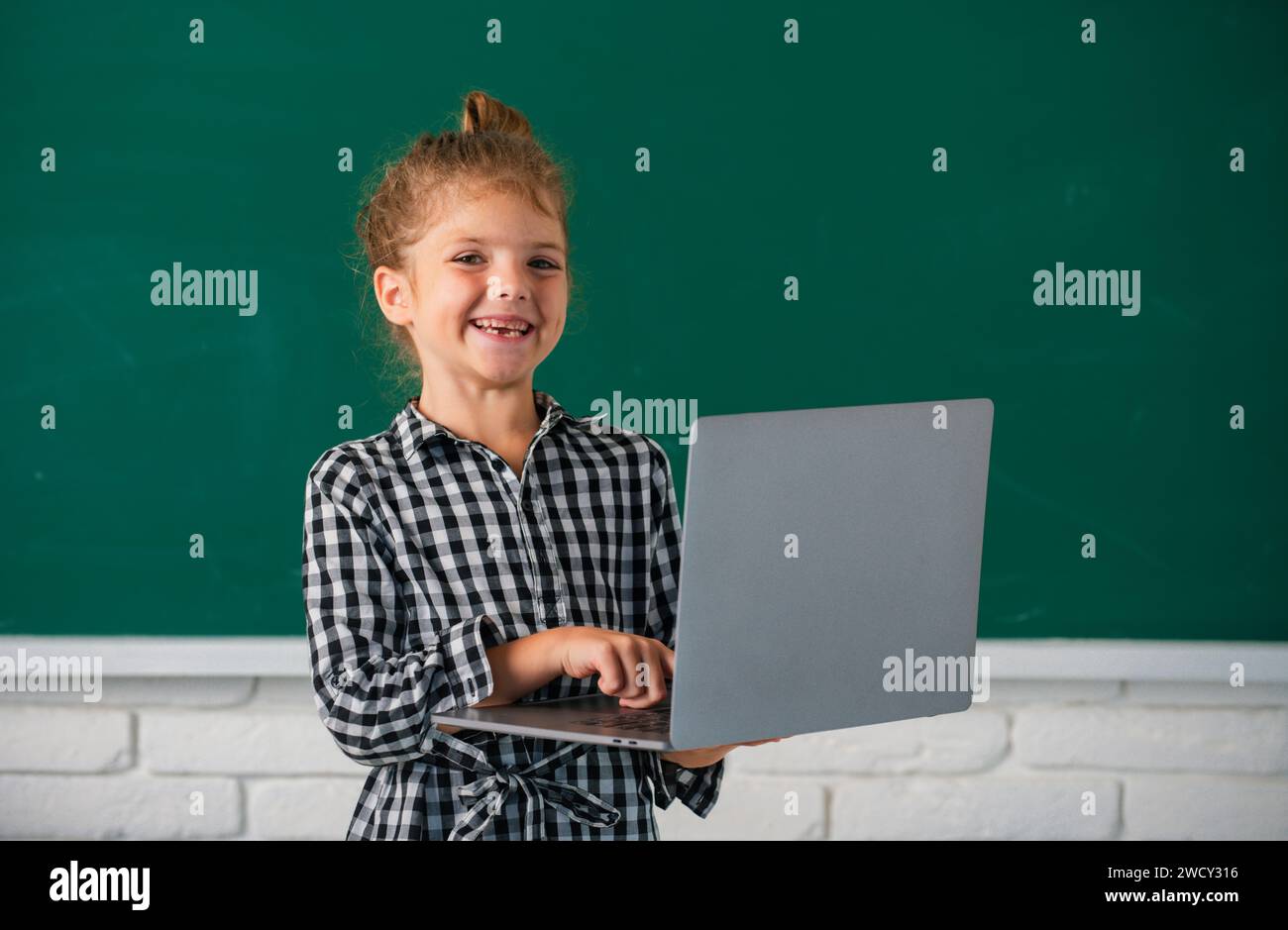 Child girl using gadgets to study. Computer education for kids Stock ...