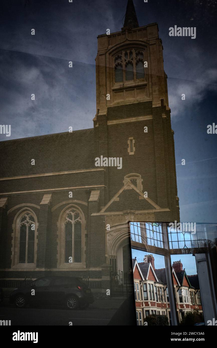 Abstract reflections of a church in a window and houses in a mirror ...