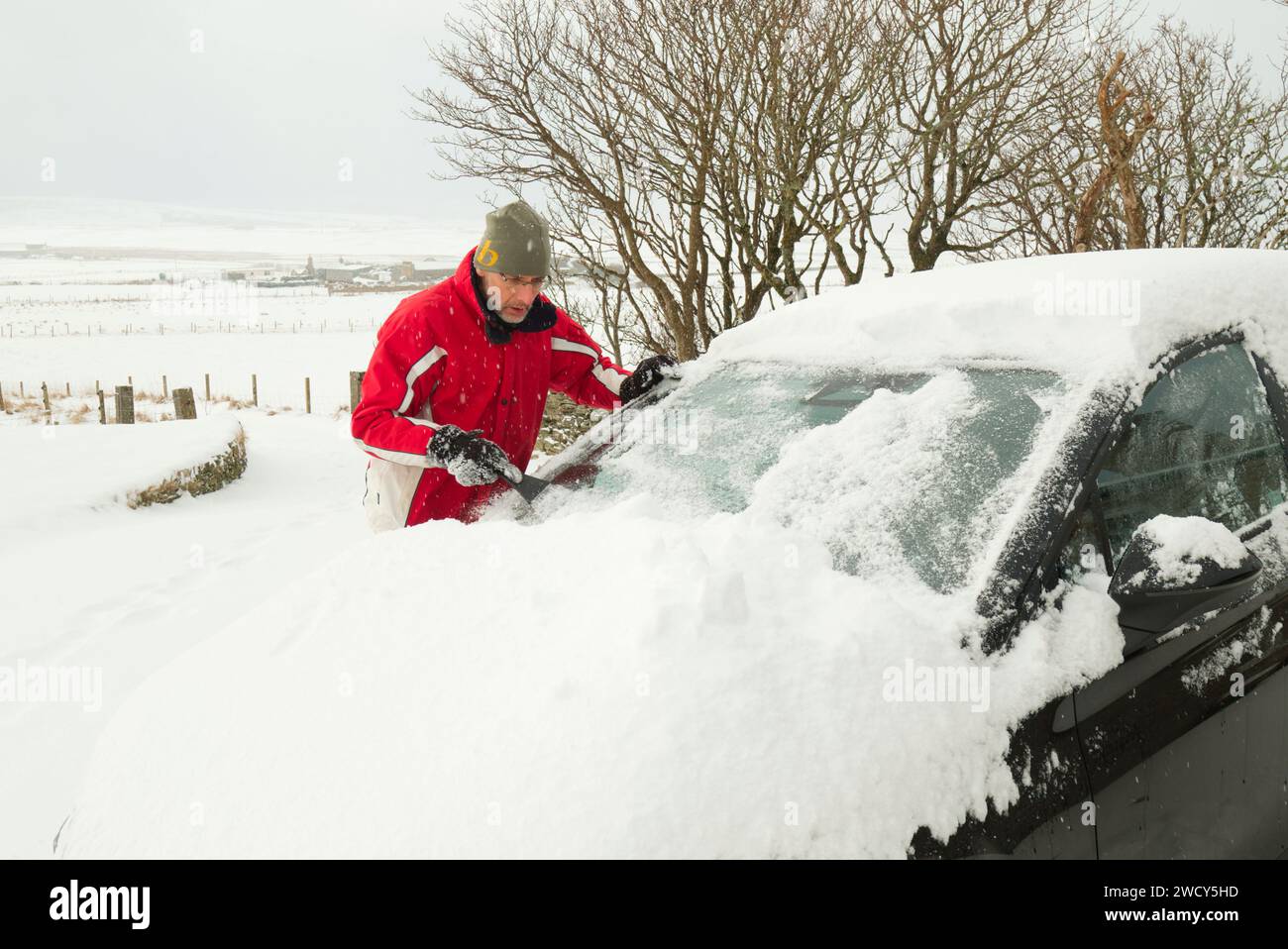 Clearing snow off car, Orkney, January 2024 Stock Photo - Alamy