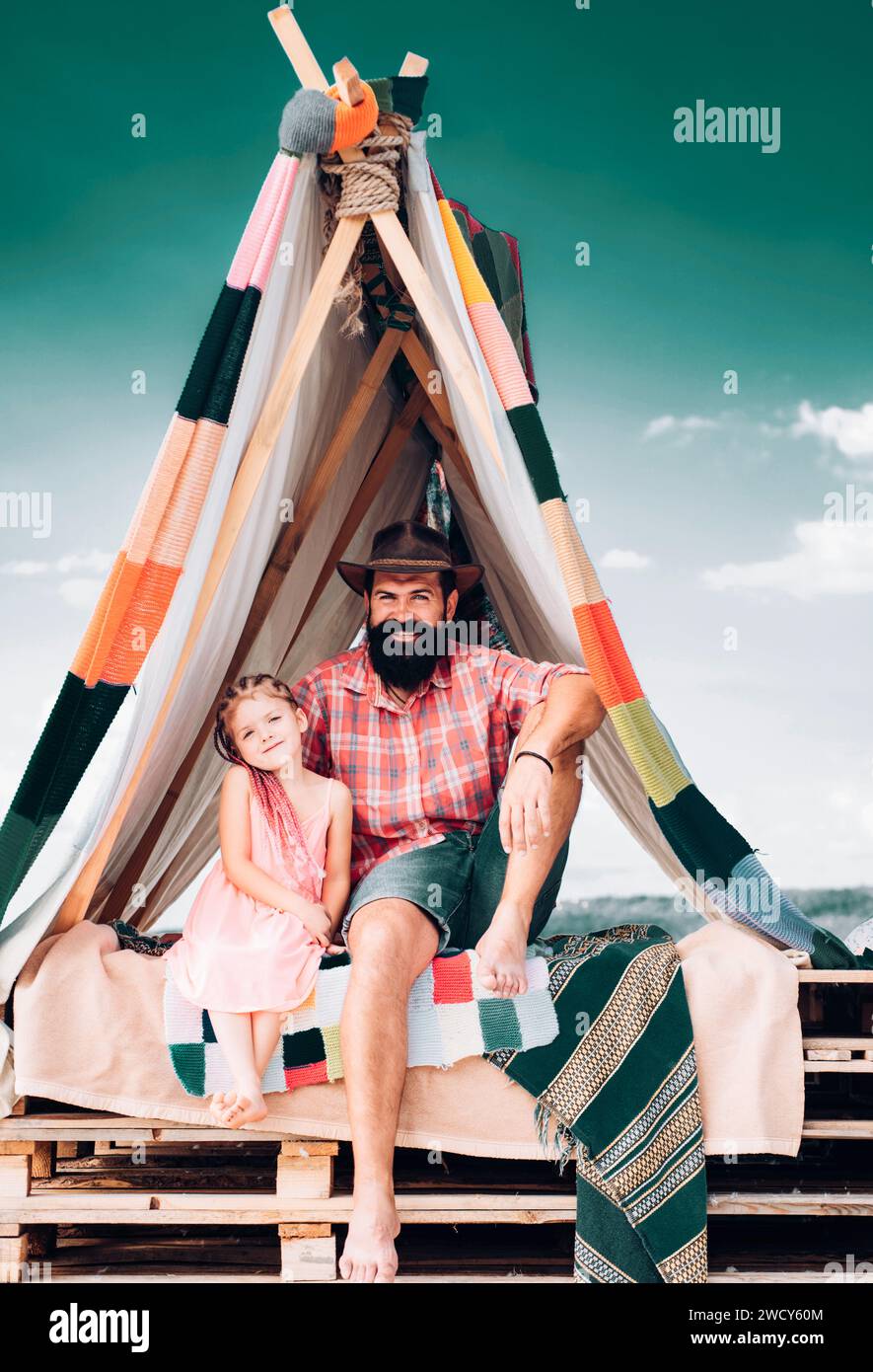 Family playing together in camp. Dad with daughter play in tent. Summer ...