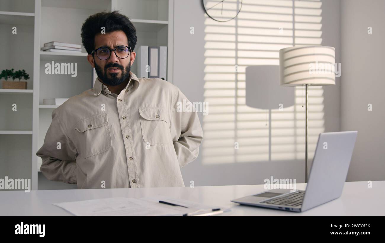 Tired exhausted Indian muslim man businessman unwell male office ...