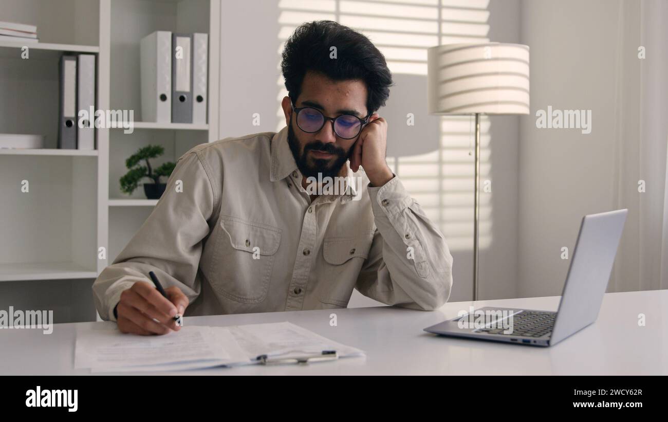 Tired bored Arabian Indian man businessman lazy employee manager boring ...