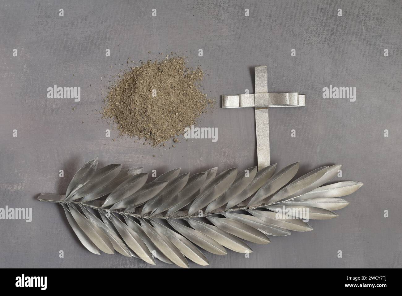 Silver palm leaf, cross and ash on grey background. Ash Wednesday concept Stock Photo - Alamy