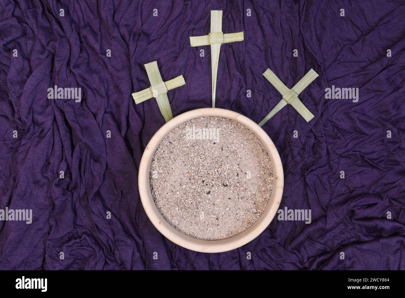 Three palm crosses and ash on purple background. Ash Wednesday concept ...