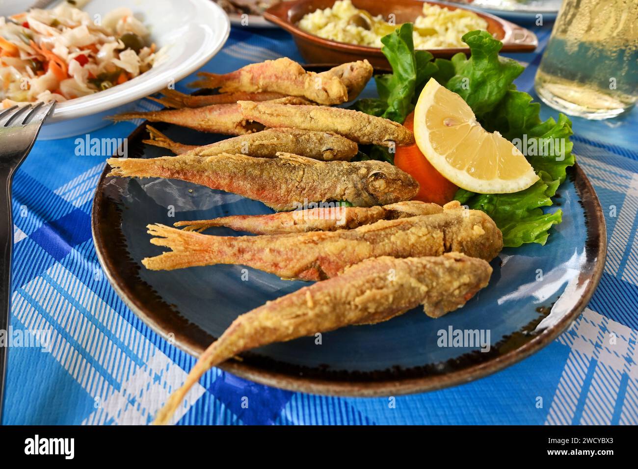 Fried crispy mullet fish hi-res stock photography and images - Alamy