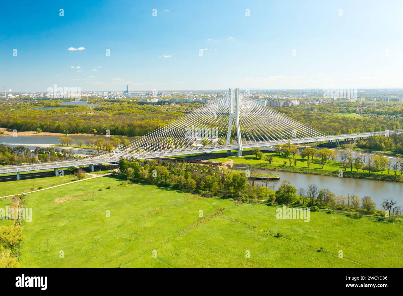Cars drive on cable-stayed Redzinski Bridge over river flowing near ...