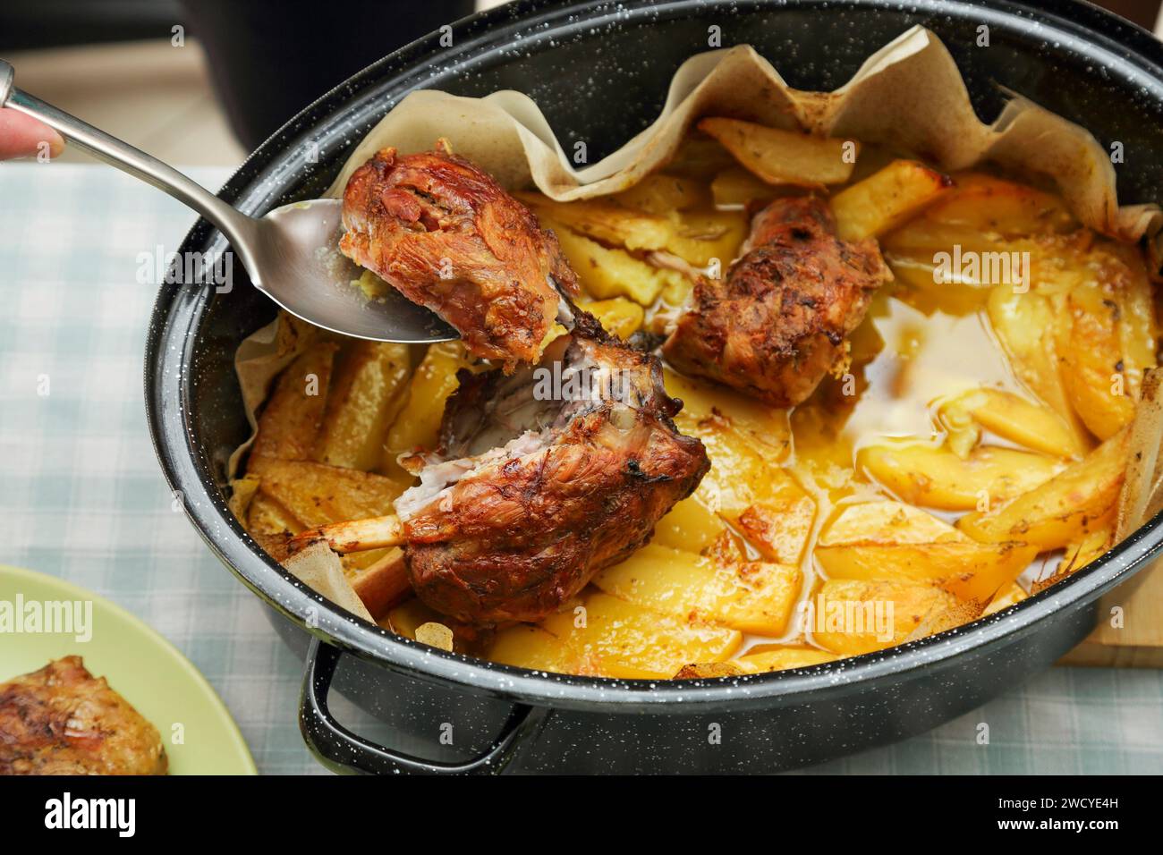 cooked pork meat with potatoes in cooking pot Stock Photo - Alamy