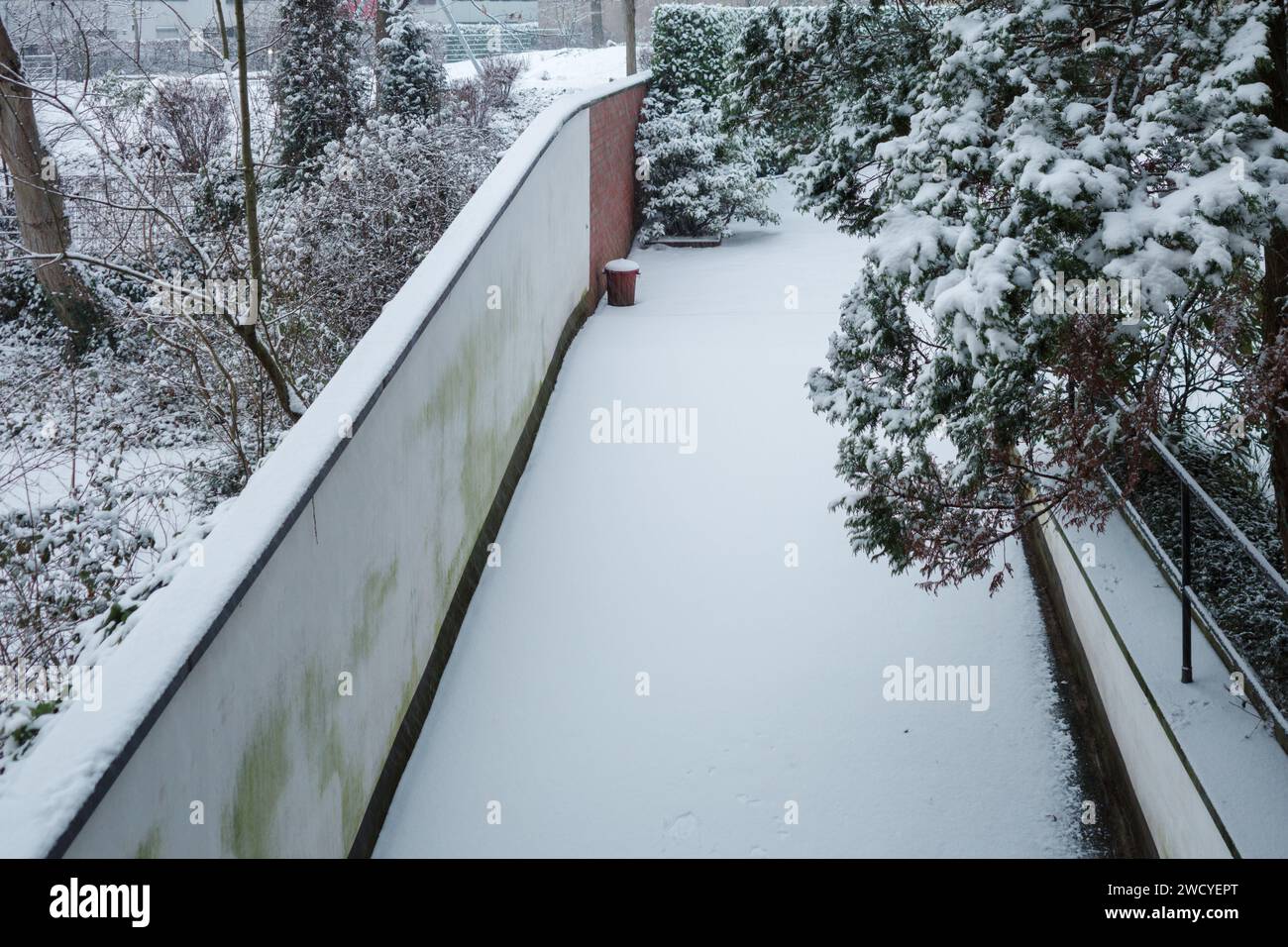 Snow-Covered Slope Leading to Apartment Basement Stock Photo - Alamy