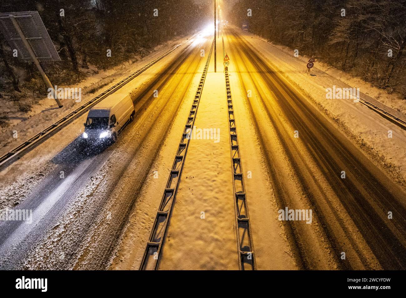 HEERLEN - Traffic drives on a snow-covered highway N281 ...