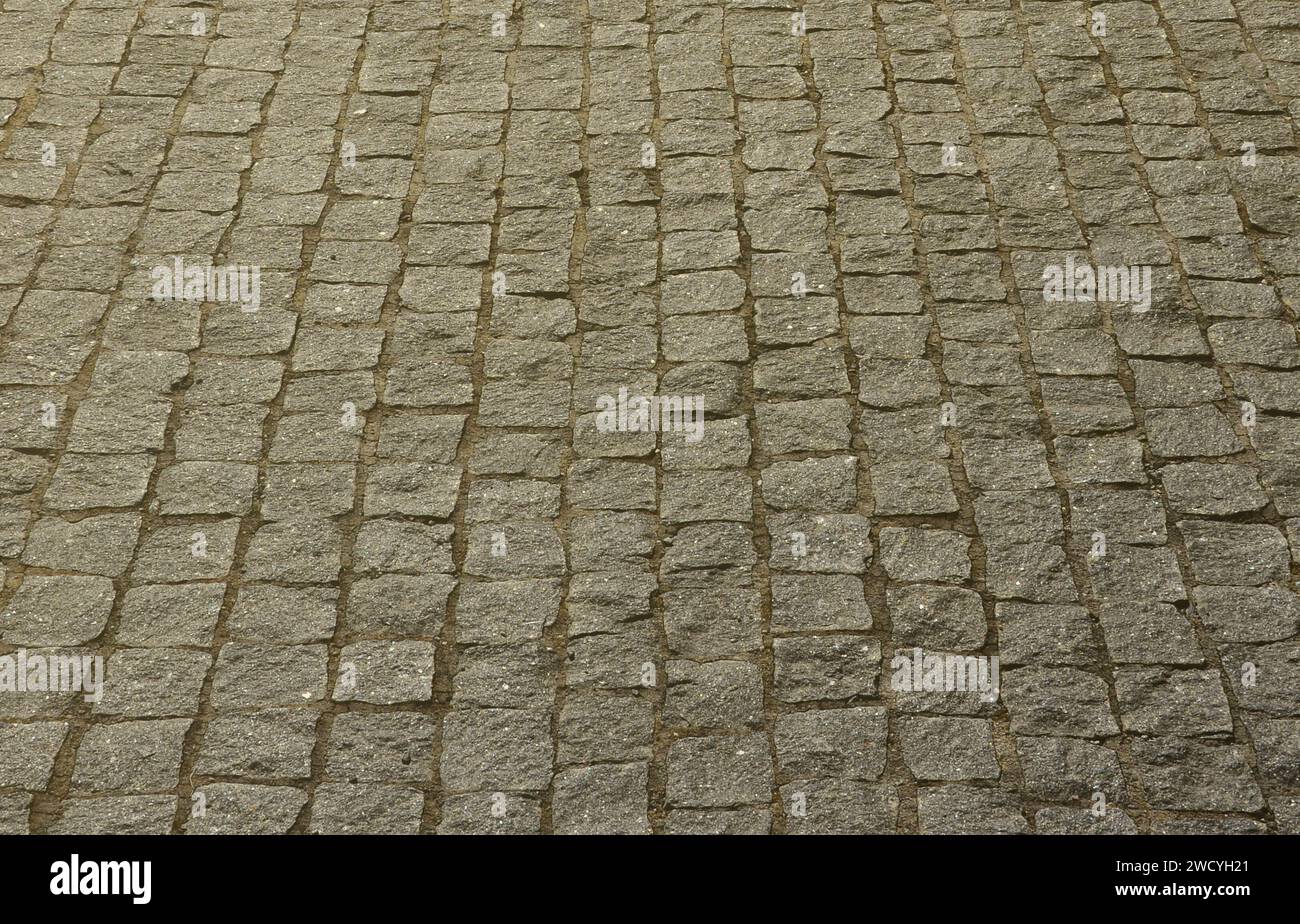 The texture of the paving slab (paving stones) of many small stones of ...