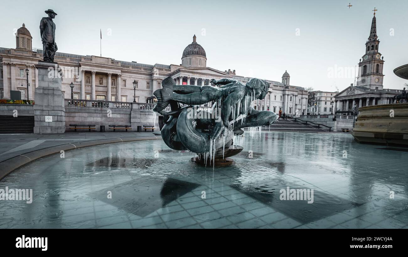Icicles on the statues in the fountains in Trafalgar Square as the cold ...