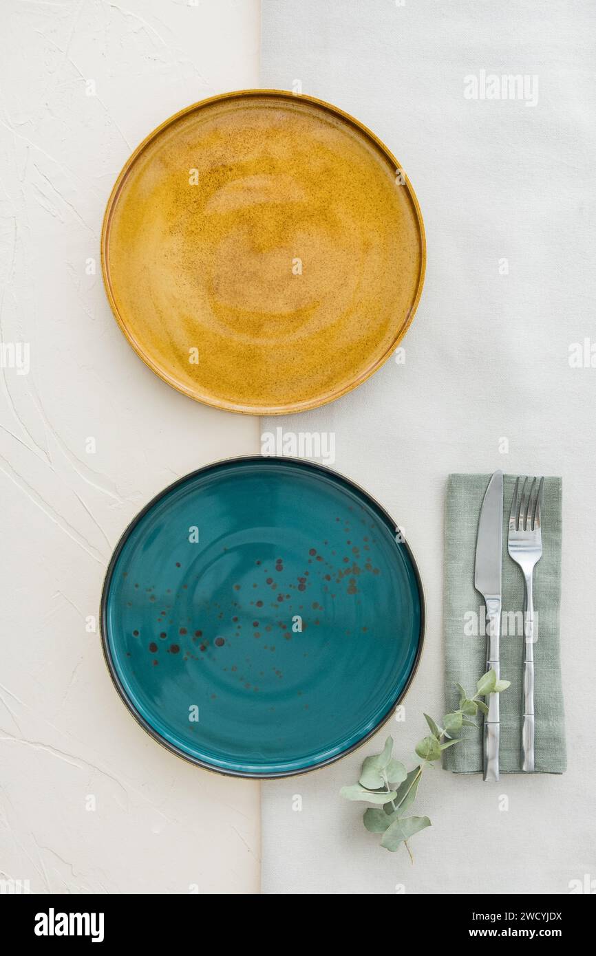 Set of two empty plates with cutlery on table. View from above Stock ...
