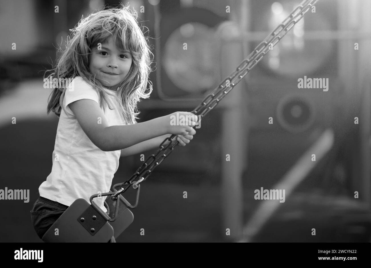 Child playing on outdoor playground. Kids play on school or ...