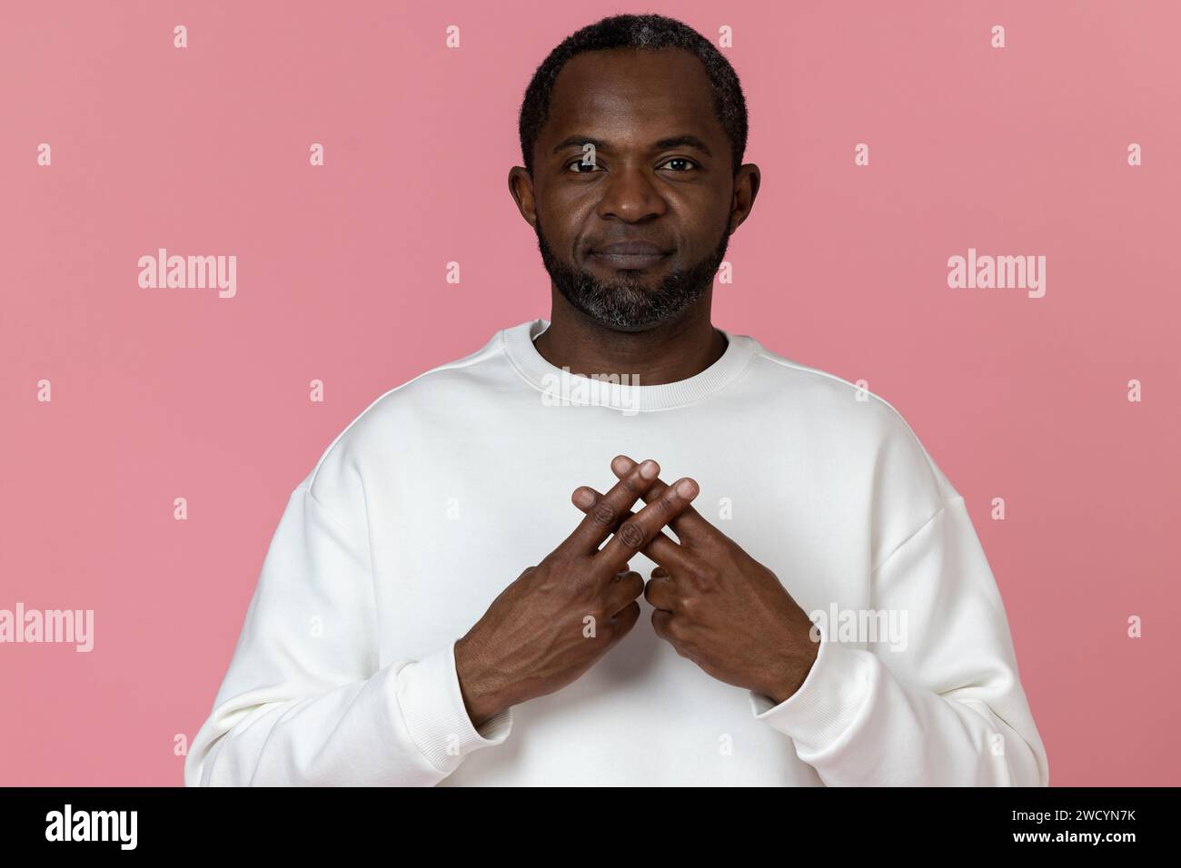 Black man wearing white sweatshirt using sign language Stock Photo - Alamy
