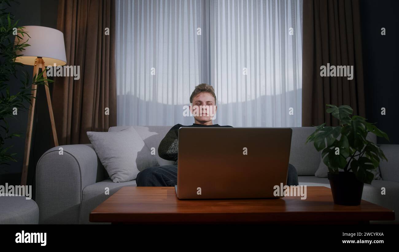 Sad male student scrolling on hi-res stock photography and images - Alamy