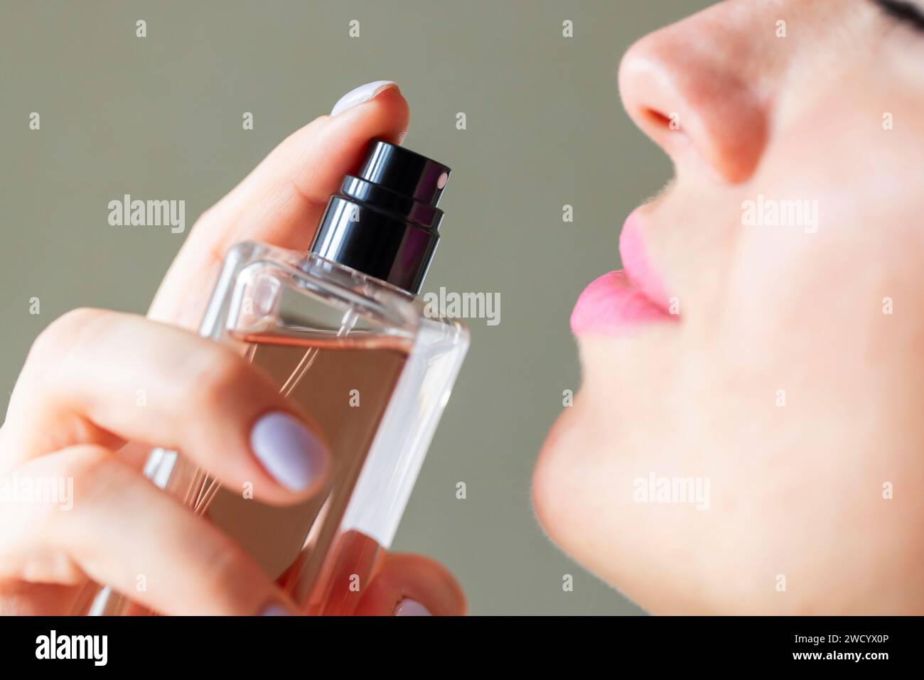 Spraying perfume from bottle hi-res stock photography and images - Alamy