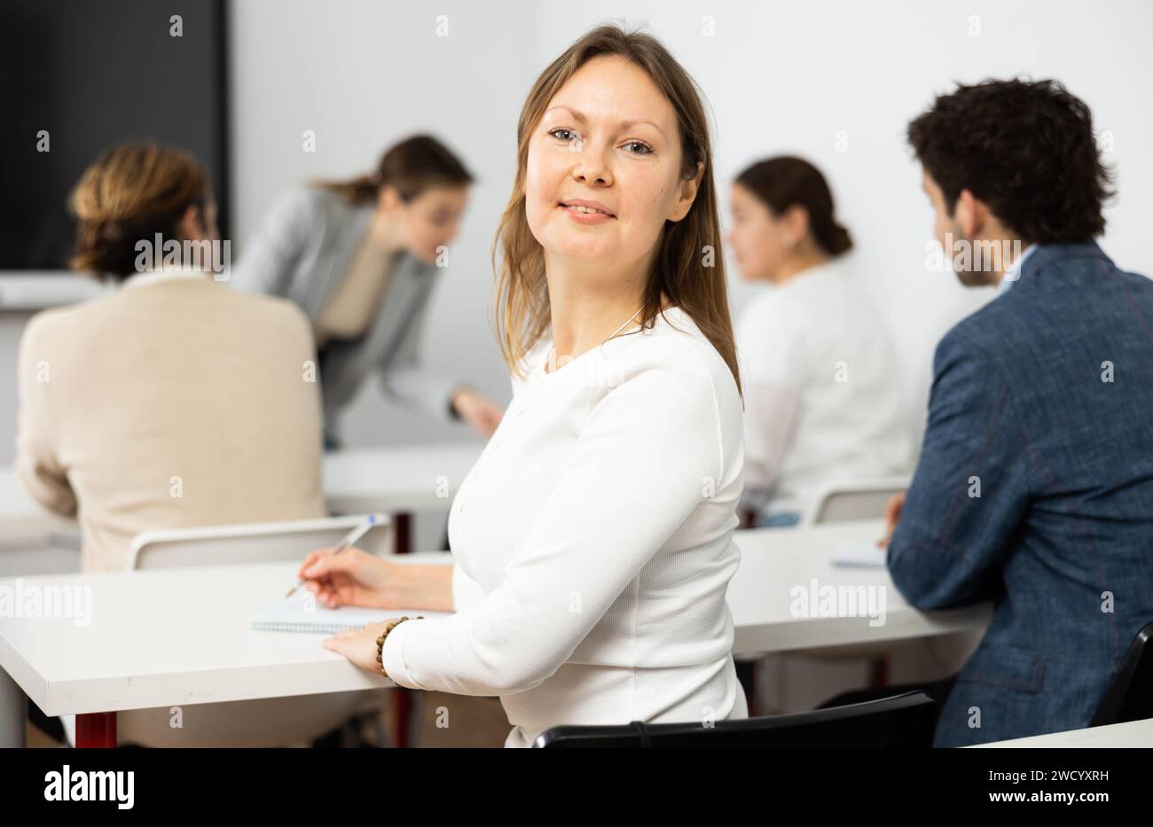 Confident female student attending class in university diligently Stock ...