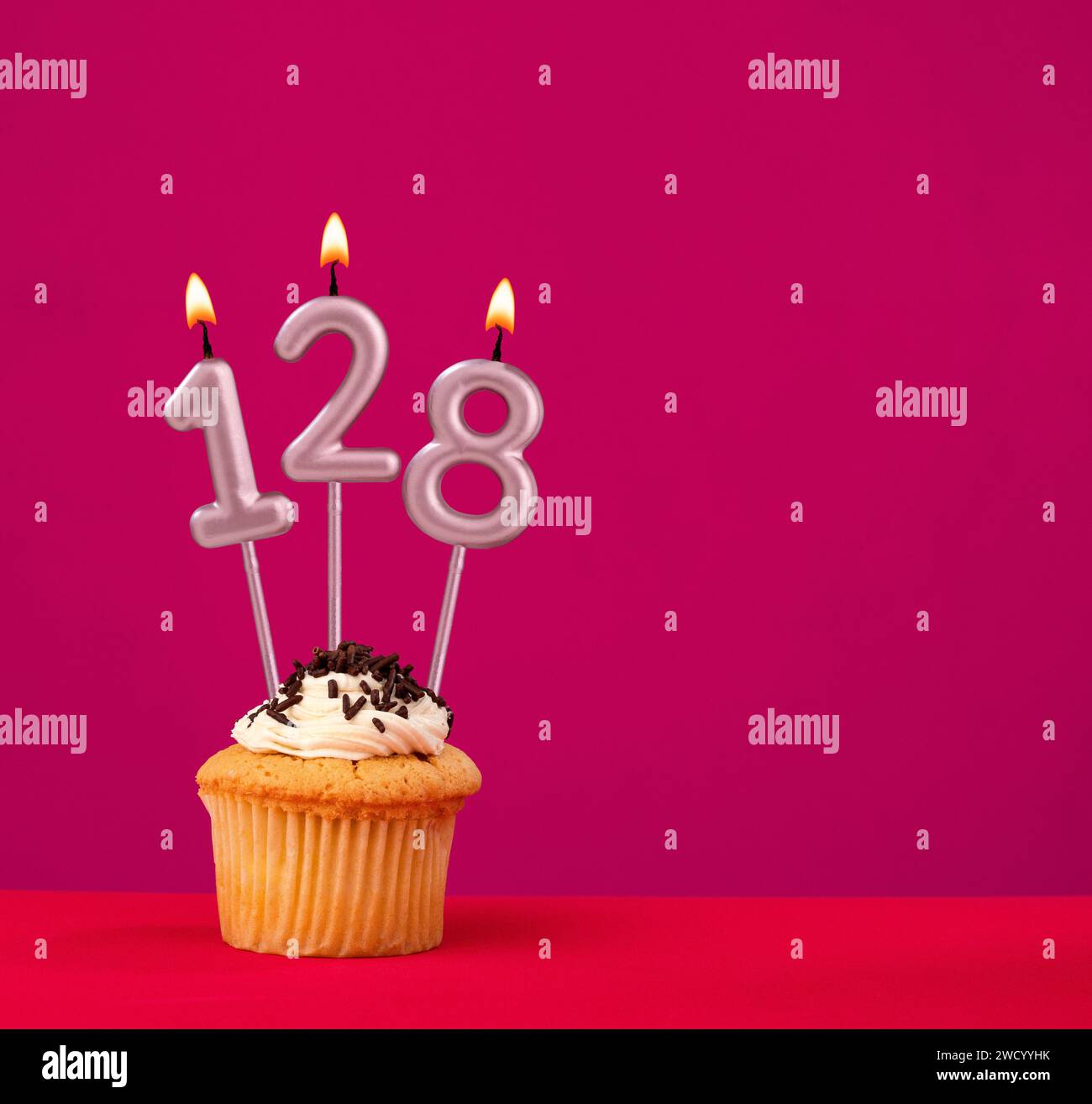 Candle number 128 - cupcake birthday in rhodamine red background Stock ...