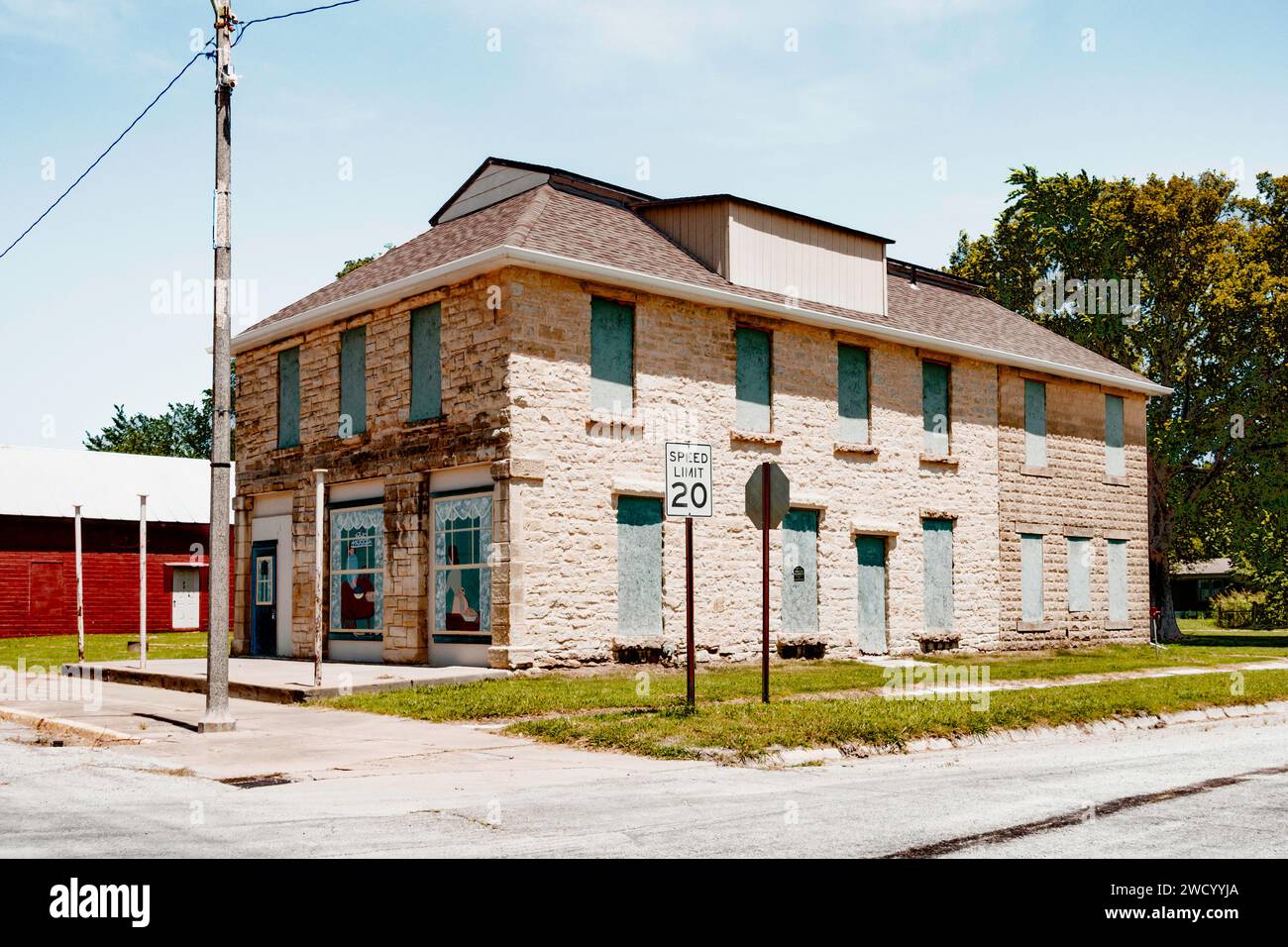 The front sandstone facade & decorative windows of a business called ...