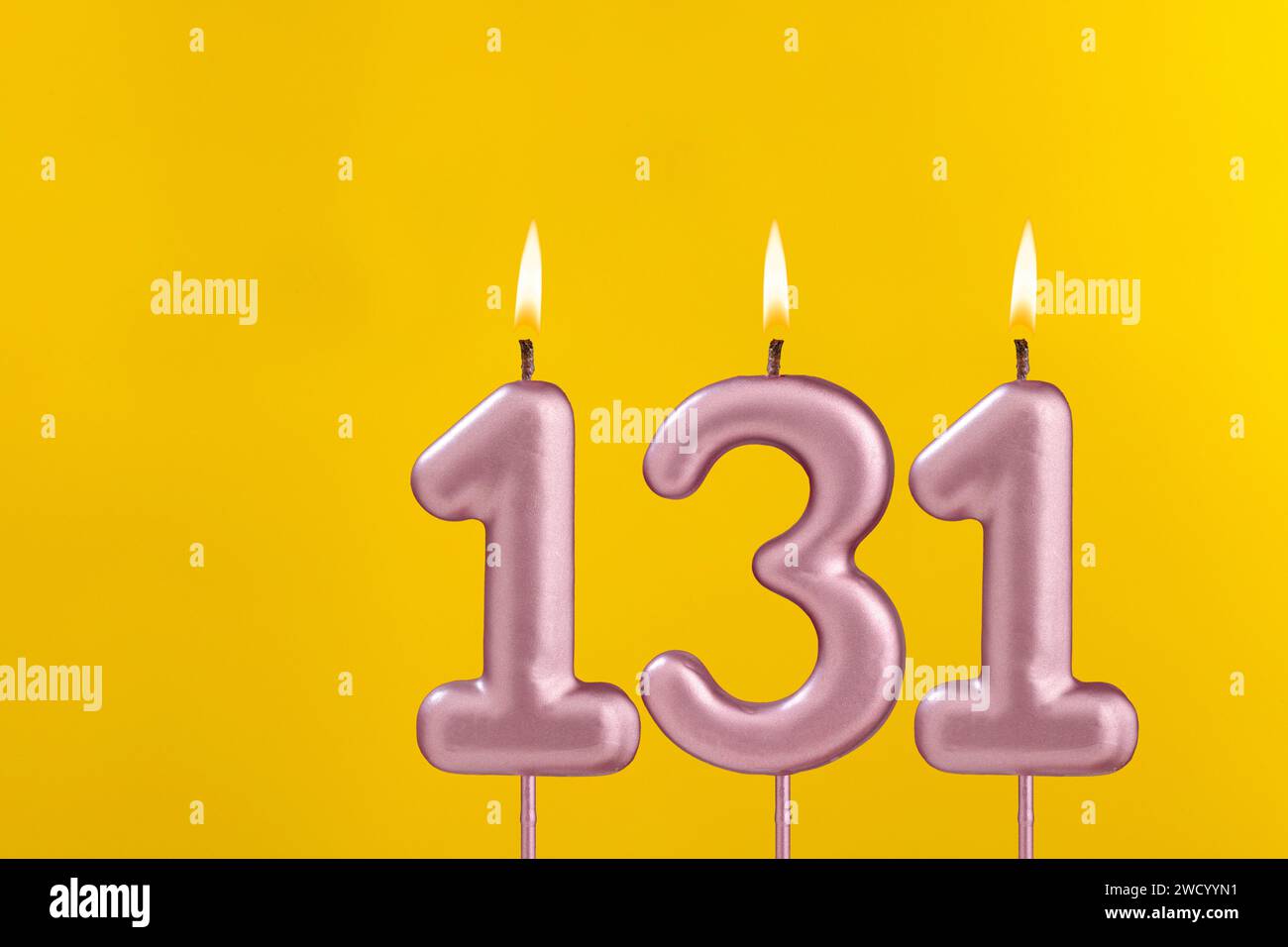 Birthday candle number 131 - Birthday celebration on yellow background ...