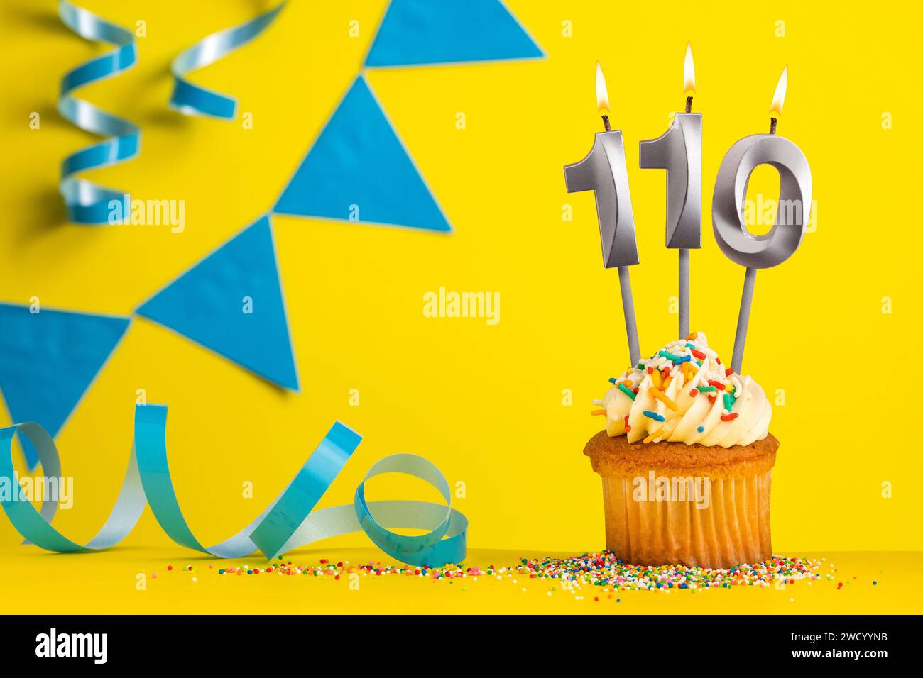 Birthday candle number 110 with cupcake - Yellow background with blue ...