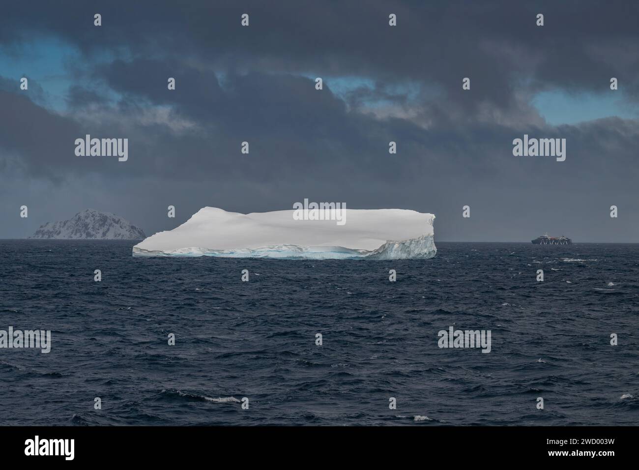 Ship near icebergs Brialmont Cove, Antarctica, Antarctic peninsula ...
