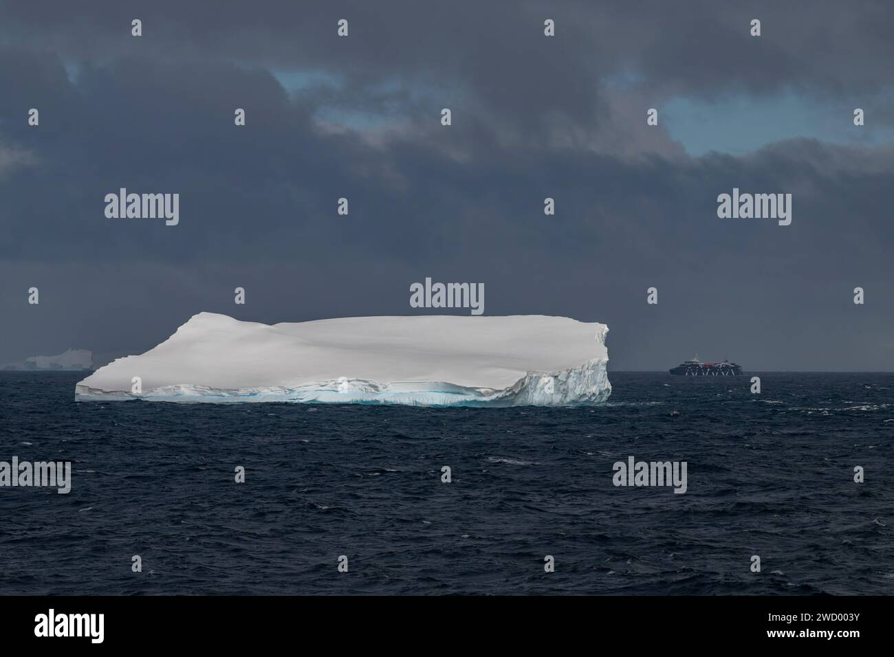 Ship near icebergs Brialmont Cove, Antarctica, Antarctic peninsula ...
