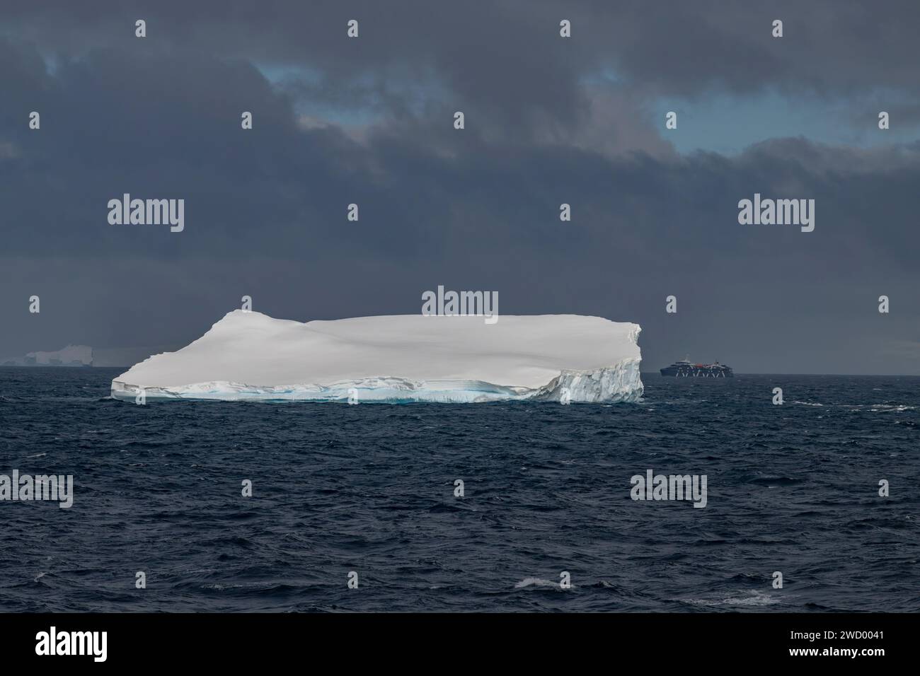 Ship near icebergs Brialmont Cove, Antarctica, Antarctic peninsula ...