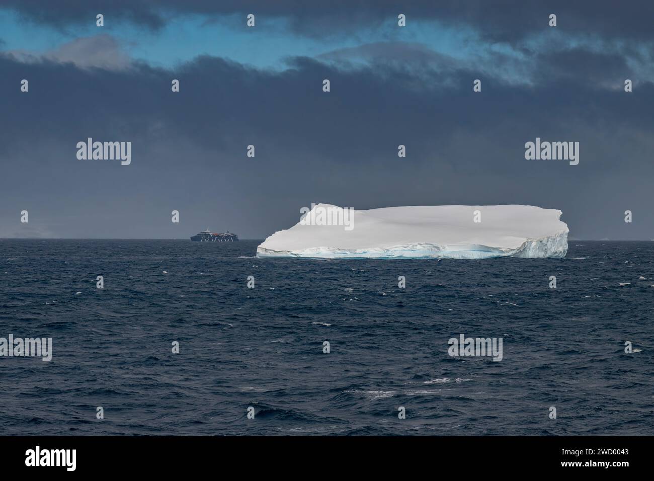Ship near icebergs Brialmont Cove, Antarctica, Antarctic peninsula ...
