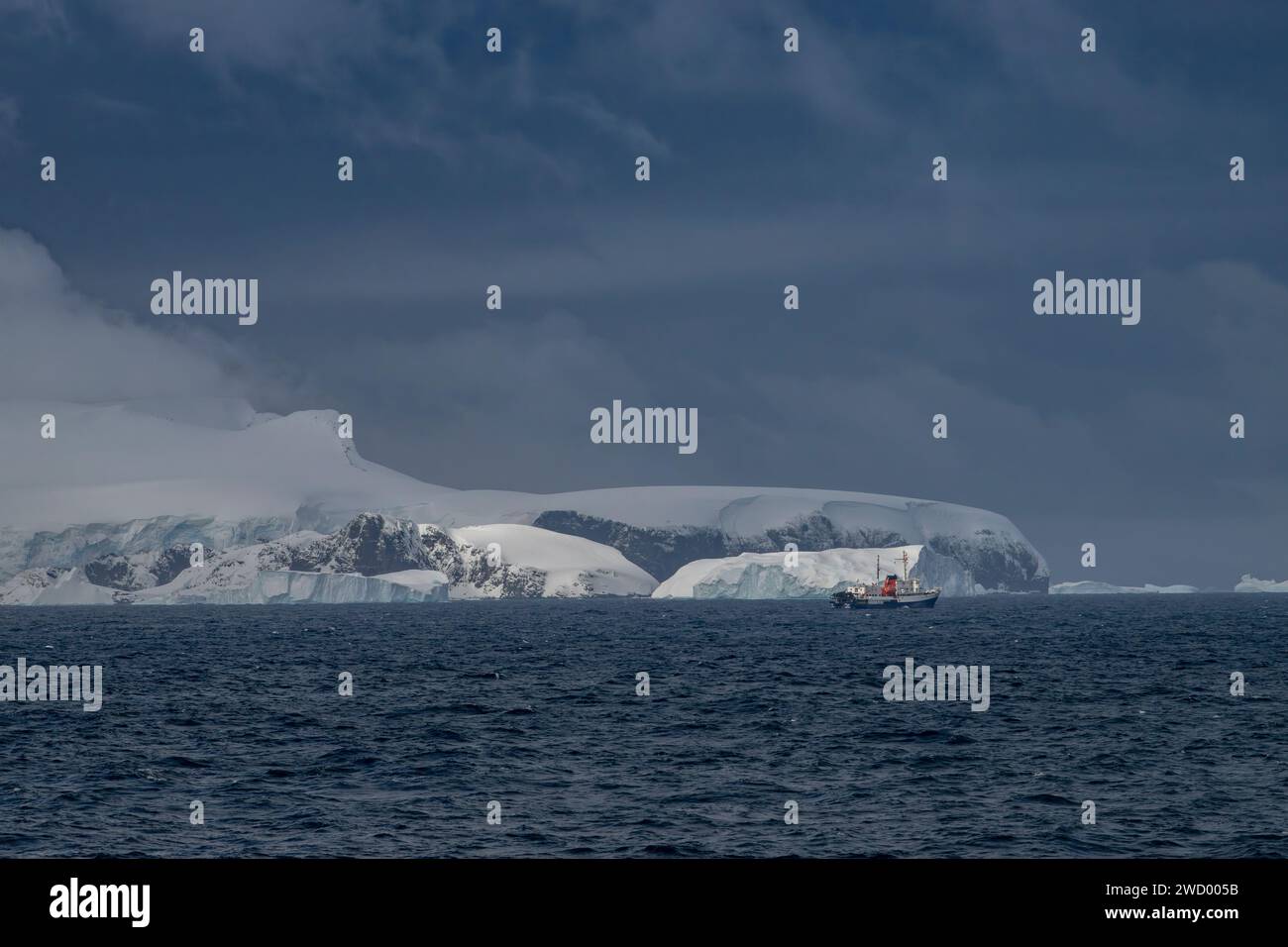 Ship and icebergs Brialmont Cove, Antarctica, Antarctic peninsula ...