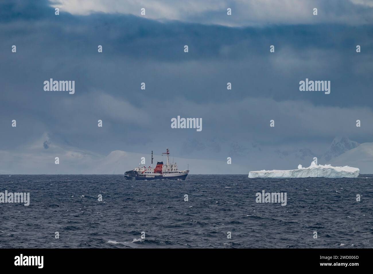 Ship and icebergs Brialmont Cove, Antarctica, Antarctic peninsula ...