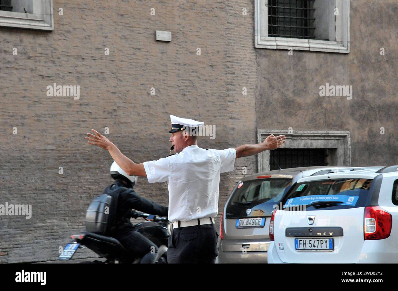 Rome / Italy 18.July 2019/ Police officer instructing traffic choas at ...