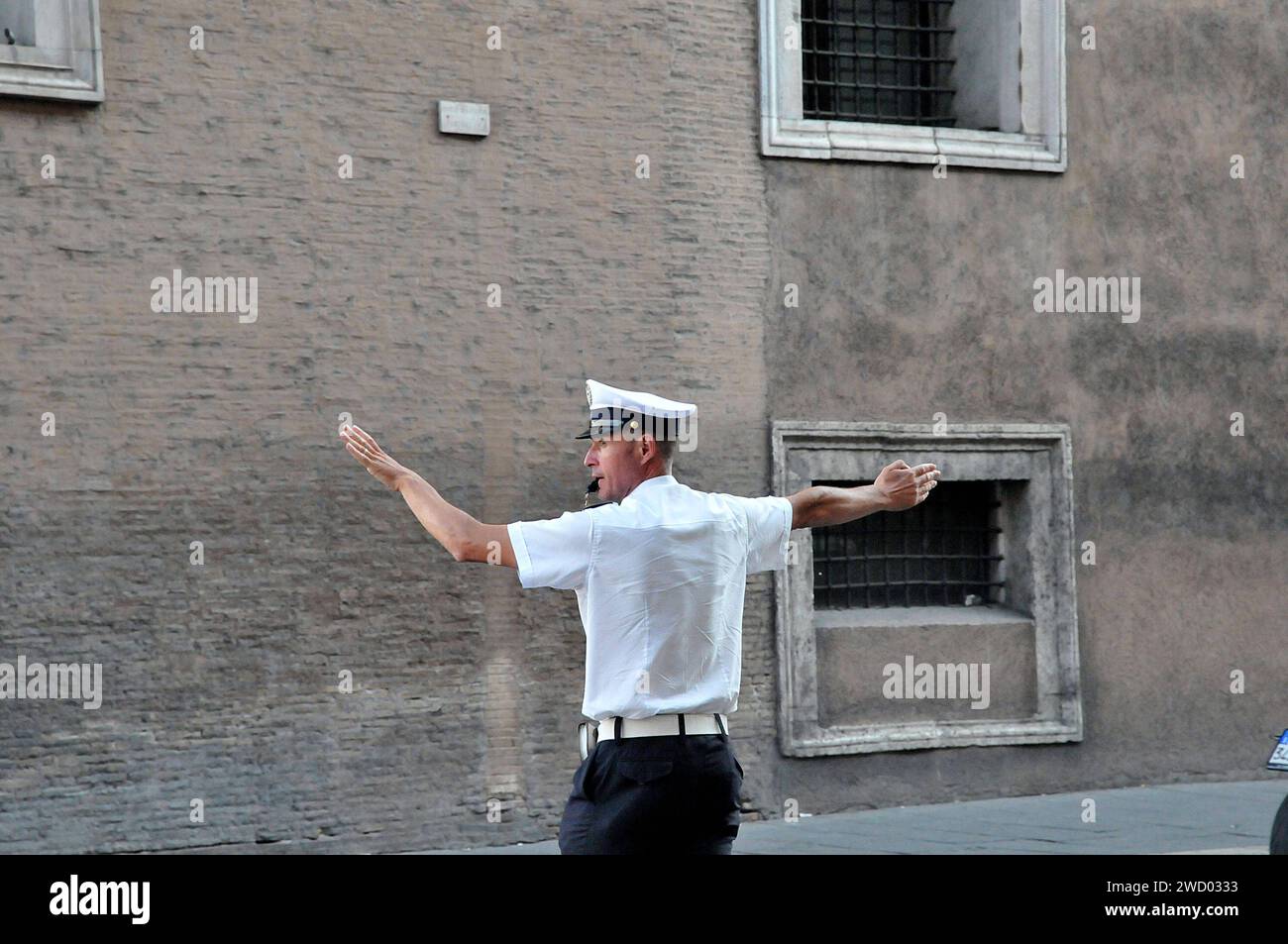 Rome / Italy 18.July 2019/ Police officer instructing traffic choas at ...