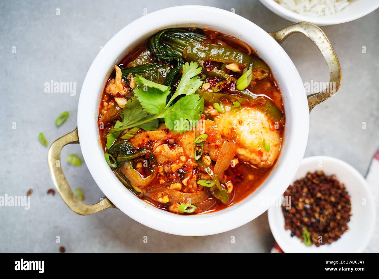 Spicy Chinese style sichuan fish hot pot served with jasmine rice Stock ...