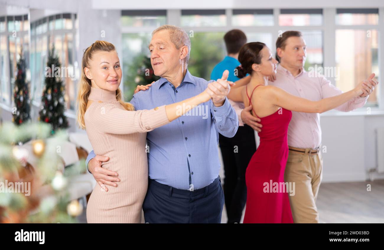 Couples dancing during Christmas - men and women dancing tango or samba ...