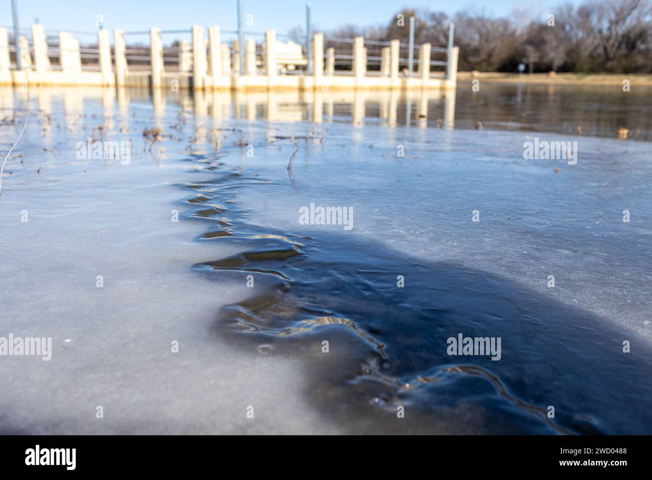 Denton, Texas, USA. 17th Jan, 2024. Ice frozen over a pound located at ...